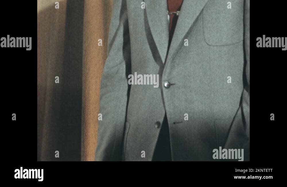 1950s: Hand holding clapperboard, clapping. Hands picking up tambourine ...