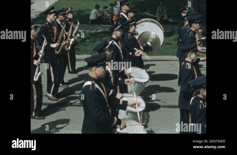 1950s: Person holding clapperboard. Marching band playing, marching in ...