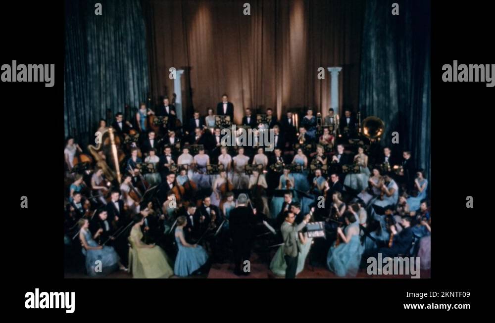 1950s: Man holding clapperboard, clapping, running. Band performing on ...