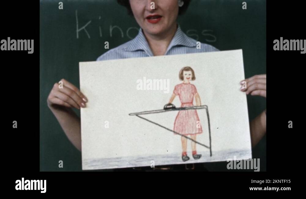 1950s: Teacher displays and hangs up drawing of woman and ironing board ...