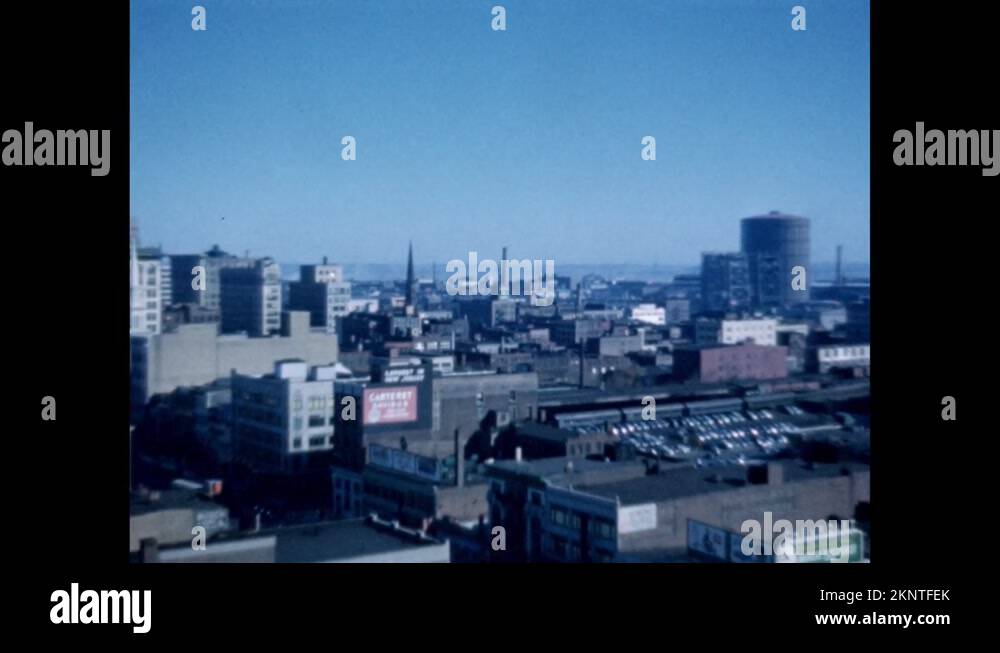 1950s: Skyscrapers and tall buildings dot city skyline. Ships sit at ...