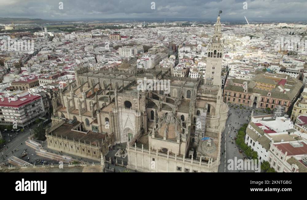 Grand Seville Cathedral with distinctive Gothic architecture; aerial ...