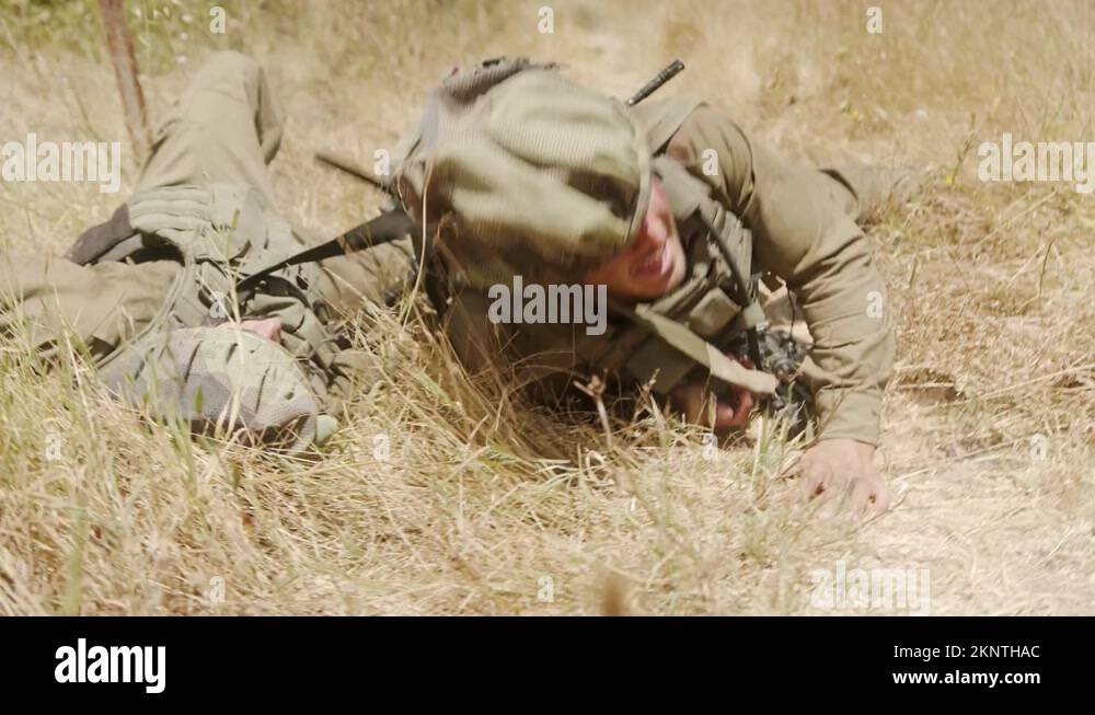 Two injured soldiers walking side by side, loosing there balance and ...