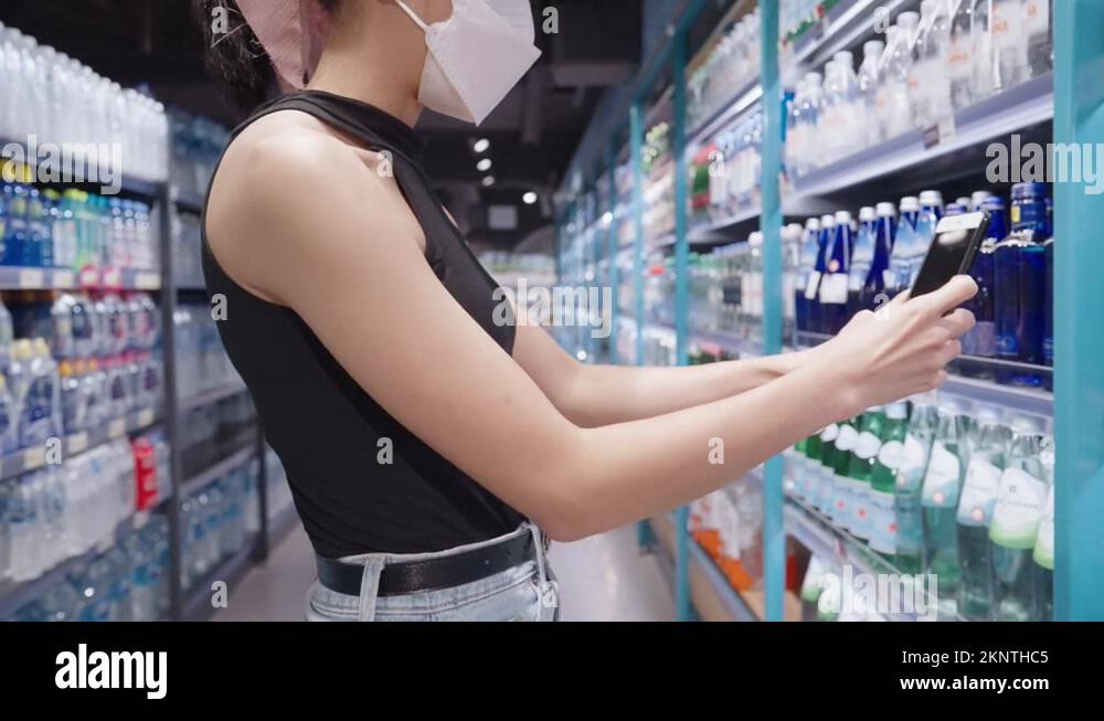 Modern young asian customer using phone scan qr code for product ...