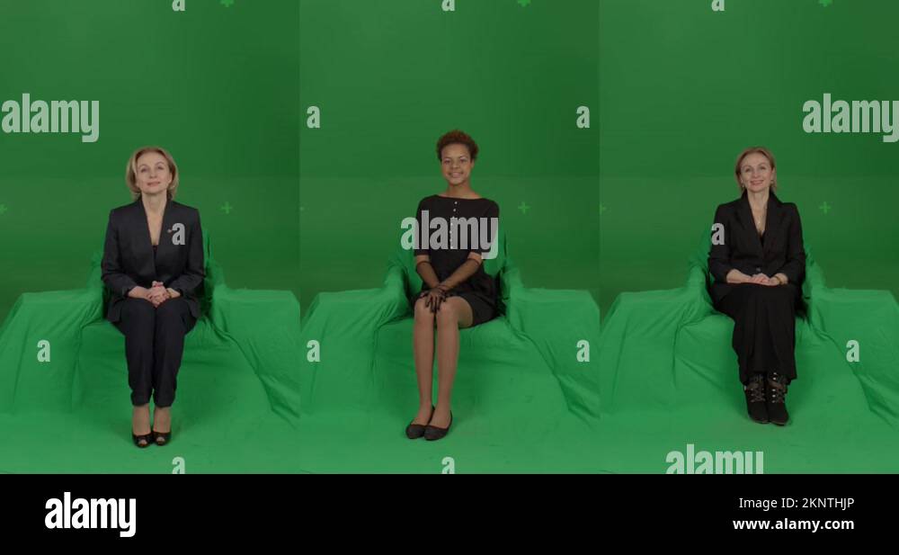GREEN SCREEN CHROMA KEY Spectators wearing formal attire watching ...