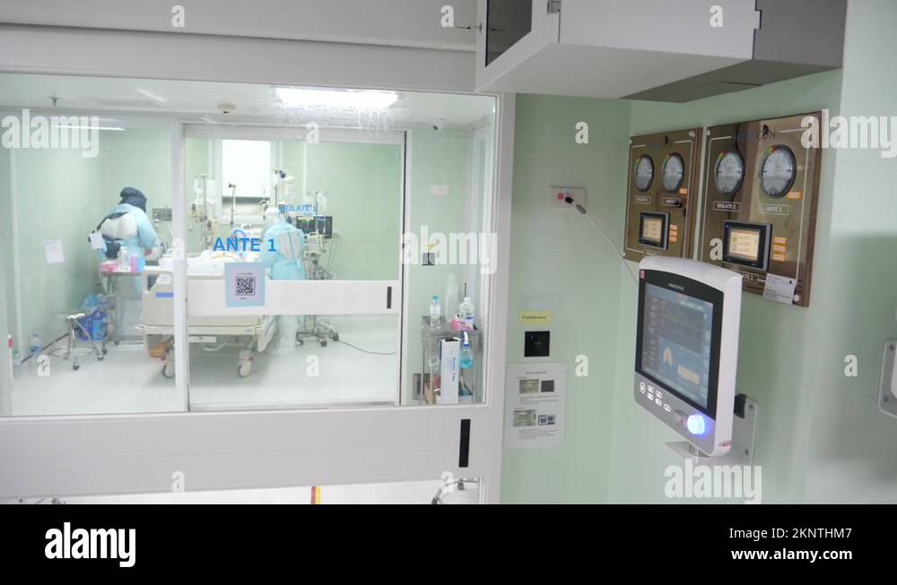 Medic Staffs Wearing PPE While Working On Negative Pressure Room Due To ...