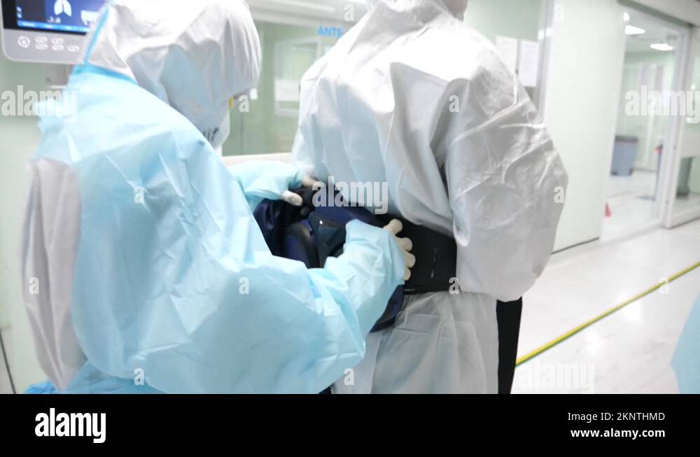 Medic Staffs Putting On PAPR (Powered Air Purifying Respirators) Suits ...