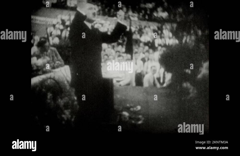 1930s: Man delivering speech on stage. Adolf Hitler giving speech ...