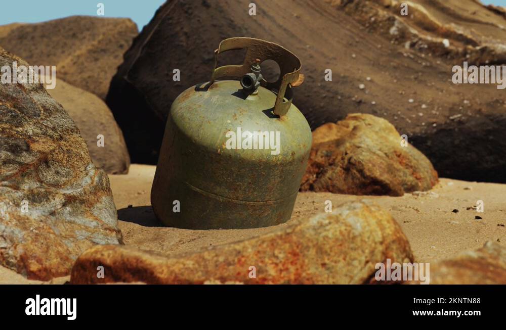 old cooking gas cylinder on sand beach Stock Video Footage - Alamy