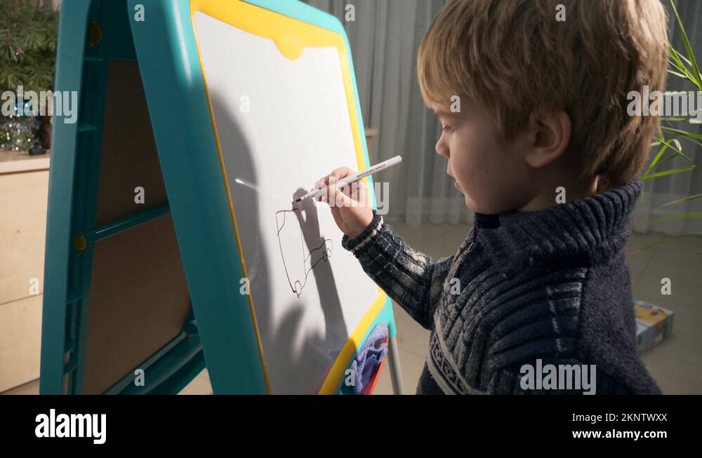 Little Boy Kid Draws with Marker on Whiteboard. Child Education at Home ...