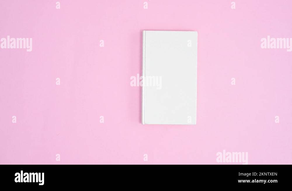 Red heart balloon fly and carry white book that opens. Stop motion ...