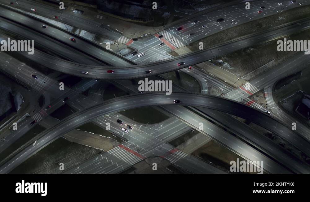 Flyover traffic jam interchange road at night, top view roadway ...
