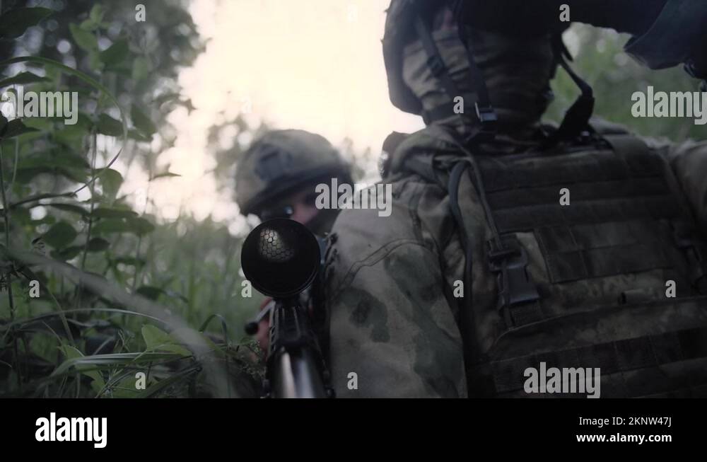 Soldier with sniper rifle on military operation, with sniper laser ...