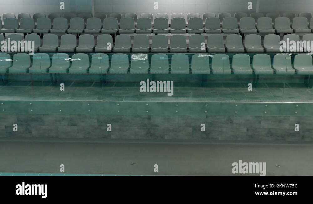 Seats for spectators in a swimming pool with clear water Stock Video ...