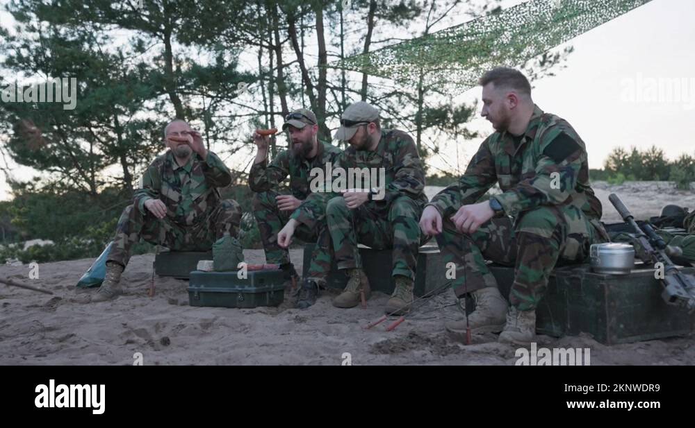 Military men in moro uniforms relaxing after an afternoon shift at the ...