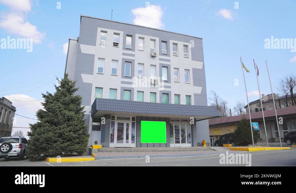 Advertising banner green screen. An office building with a green screen ...