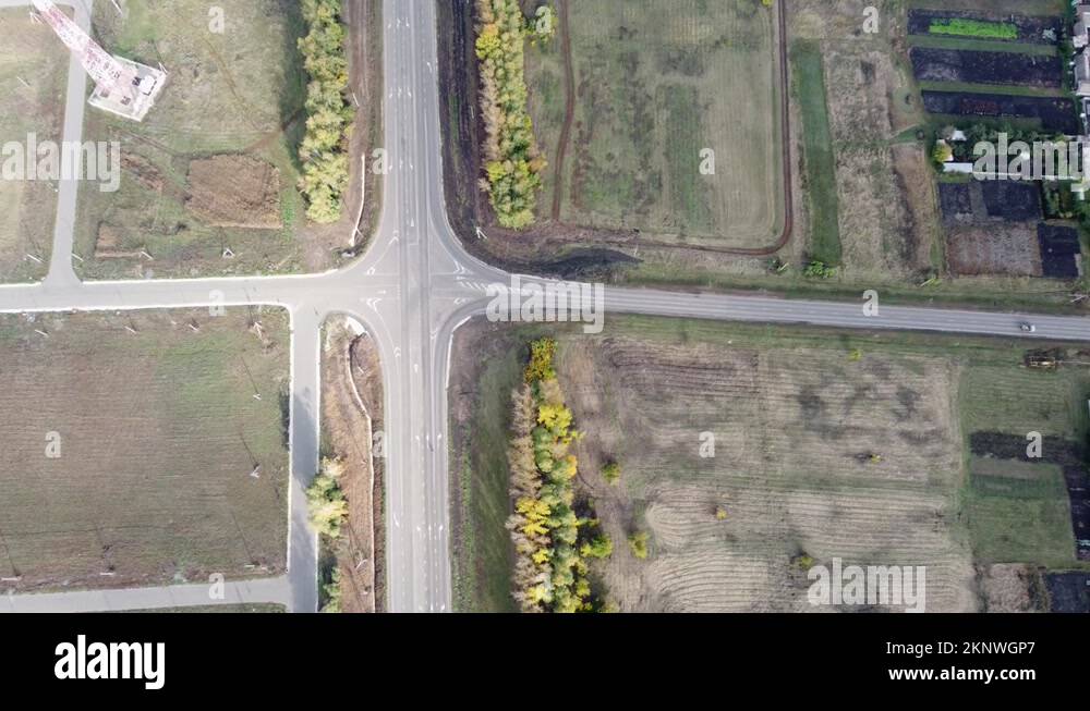 road intersection top view, drone shooting, paved intersection with ...