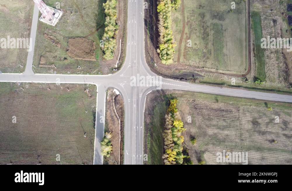 road intersection top view, drone shooting, paved intersection with ...