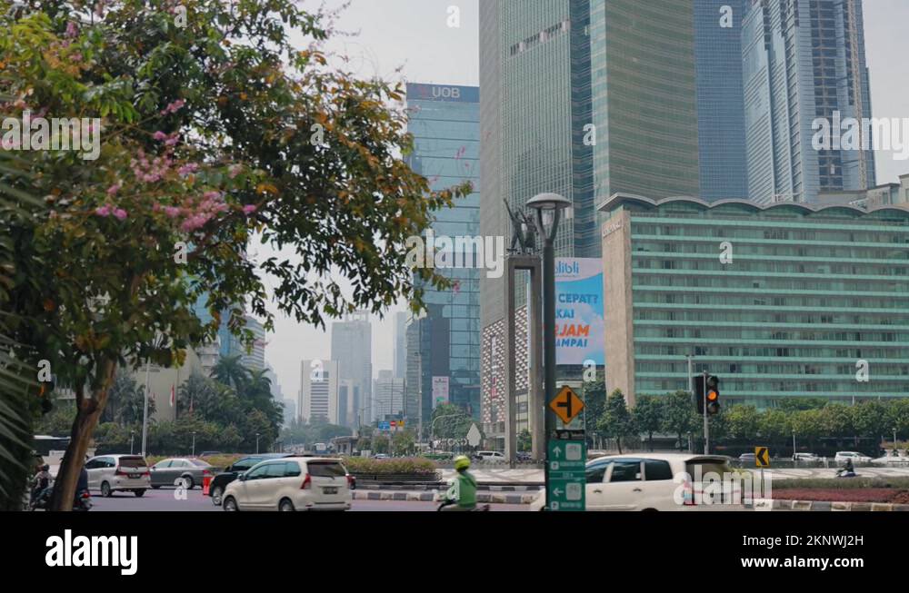 JAKARTA, INDONESIA- 12/12/2021: Tracking Shot Revealing Busy Traffic In Downtown Stock Video ...