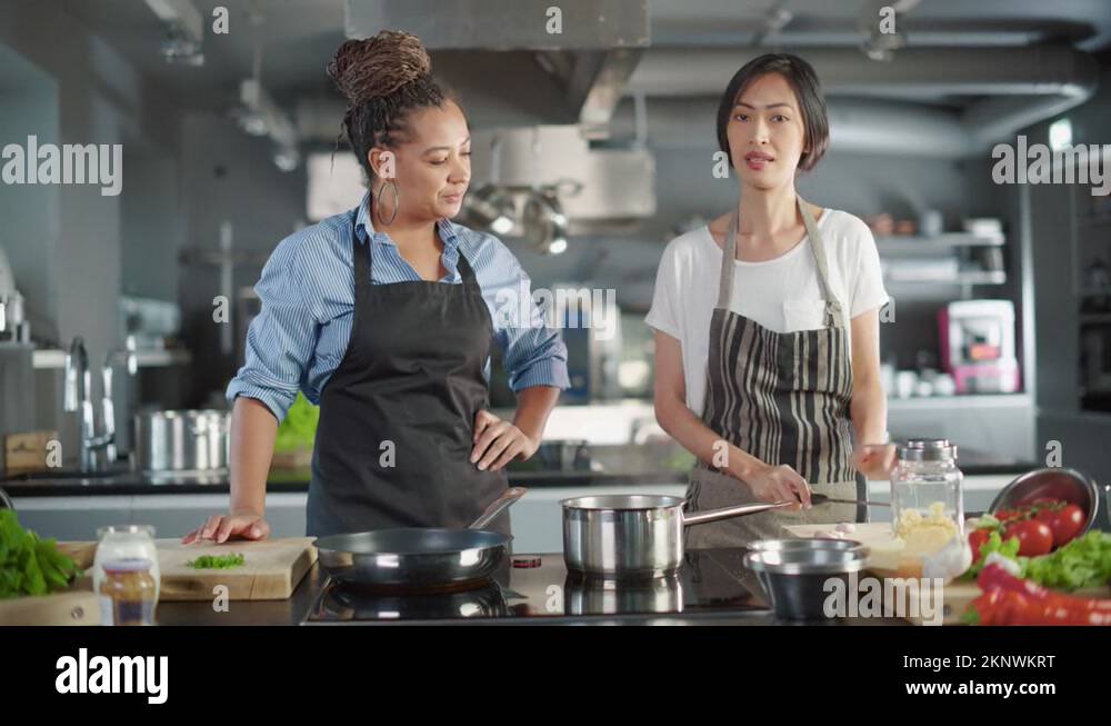 Two Chefs Cooking Talking Stock Video Footage - Alamy