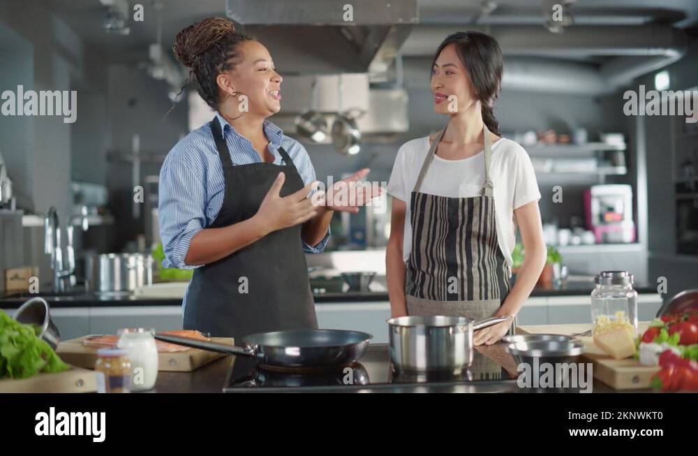 Two Chefs Cooking Talking Stock Video Footage - Alamy