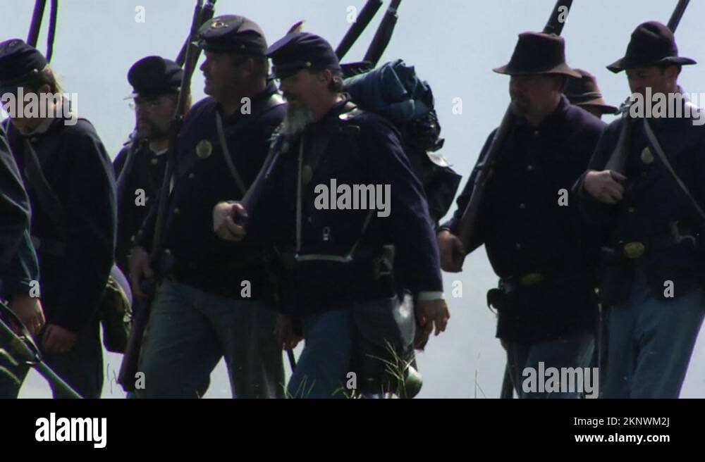 Civil War Union Soldiers Marching across a Re-enactment Battlefield ...