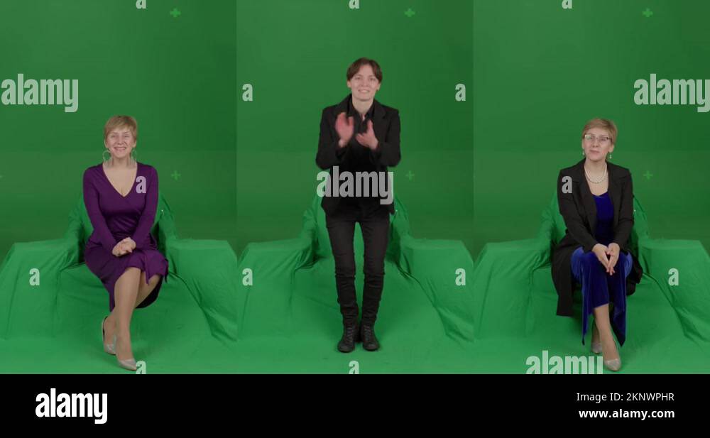 GREEN SCREEN CHROMA KEY Spectators wearing formal attire applaud at ...