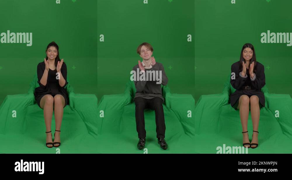 GREEN SCREEN CHROMA KEY Spectators wearing formal attire applaud at ...