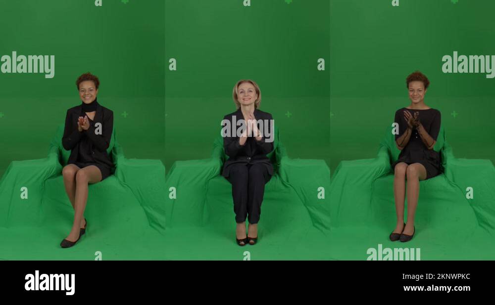 GREEN SCREEN CHROMA KEY Spectators wearing formal attire applaud at ...