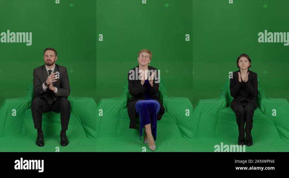 GREEN SCREEN CHROMA KEY Spectators wearing formal attire applaud at ...