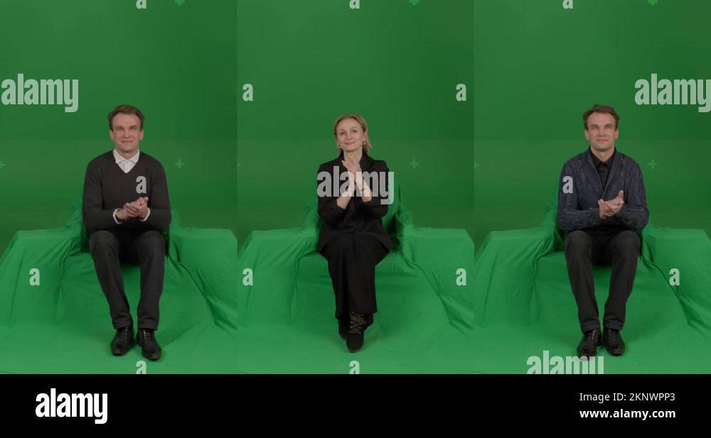 GREEN SCREEN CHROMA KEY Spectators wearing formal attire applaud at ...