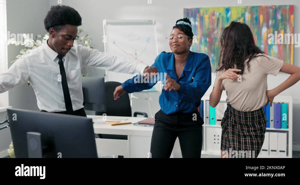 Dance at work, office, break from duties, company party, two girls and ...