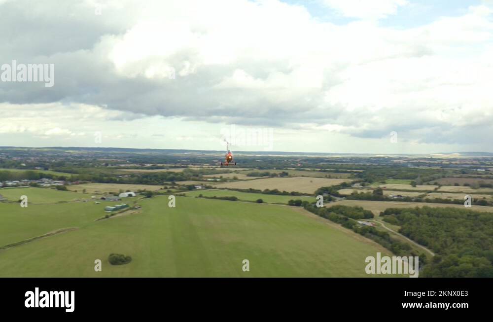 Gyrocopter 4k CINEMATIC PIVOT above fields and trees Stock Video ...