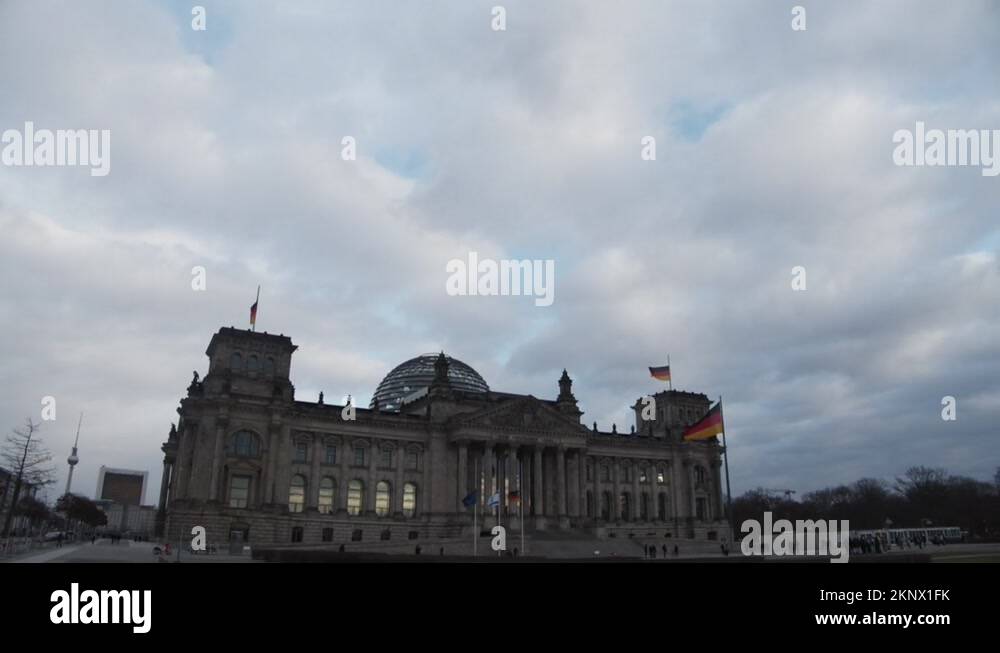 Cloudy sky, tilt down reveal of historic and famous building of German ...