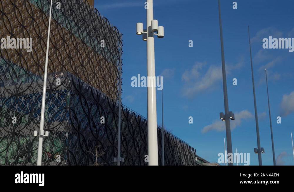 Low aerial view of Birmingham central library in the UK with people ...