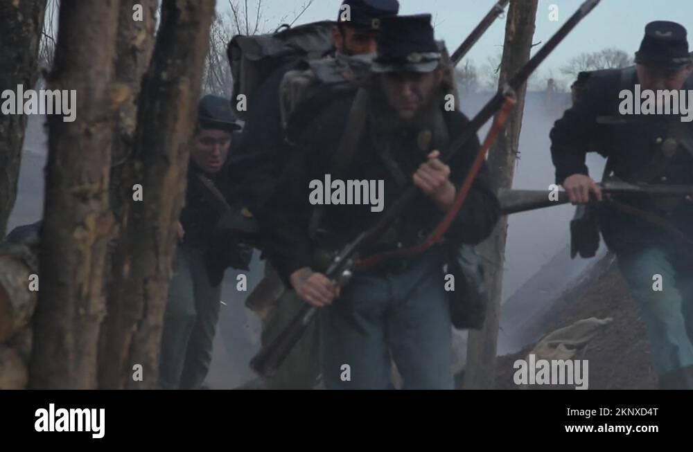 Civil War Union Soldiers attack Confederates through smokey earthworks ...