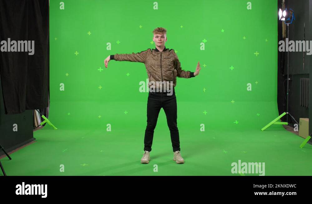 young man dancing on green screen background Stock Video Footage - Alamy
