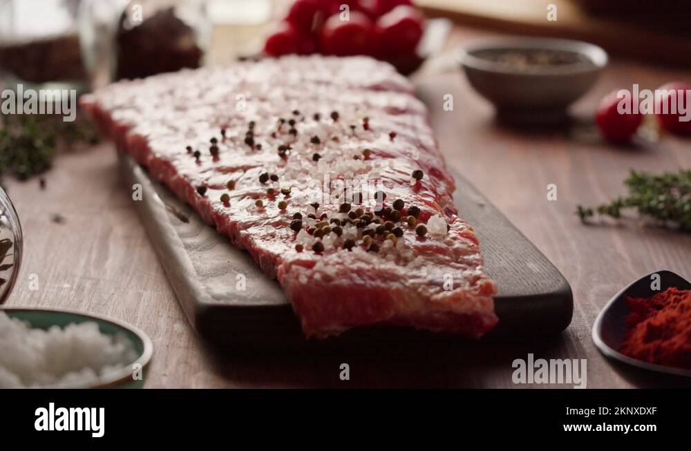 Woman chef cooking ribs close-up. Professional chef preparing pork ...