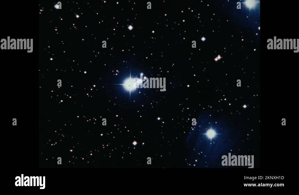 1970s: Photograph of star of various sizes and distances in the night ...