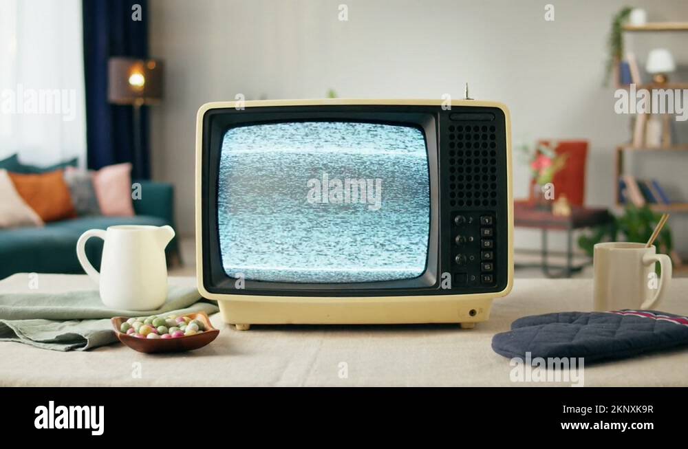 Old television with grey blank screen on home background living room ...