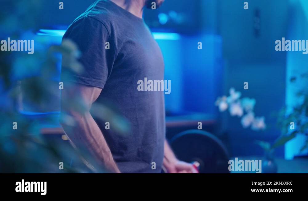 Barbell biceps curl exercise headless male person at home in kitchen 4K ...