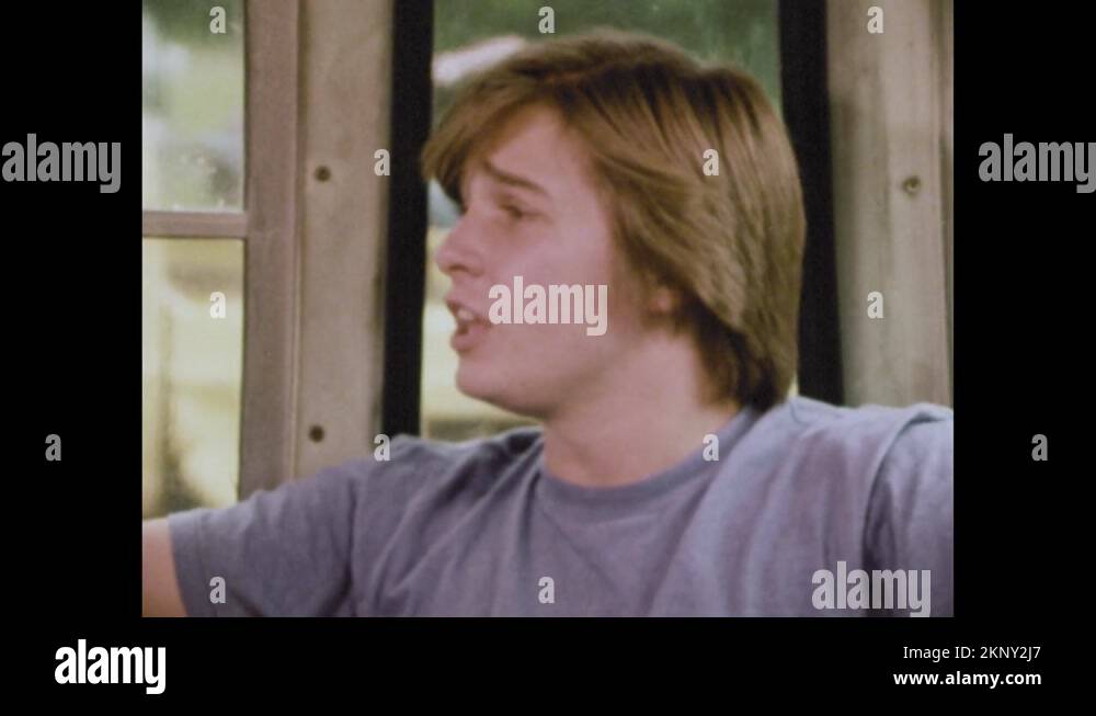 1970s: Boy in back of bus making a point. Boy laying in hospital bed ...