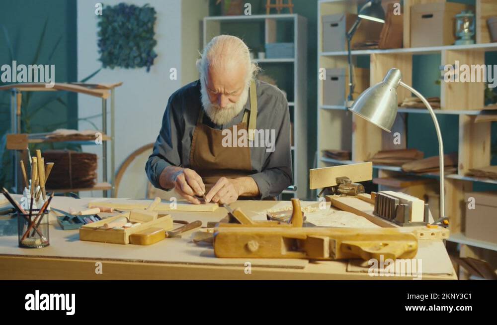 Professional Elderly Man Carpenter Working on Wood Using Carpentry ...