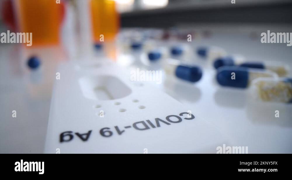 Express test for covid 19 antigen lying among many medical capsules ...