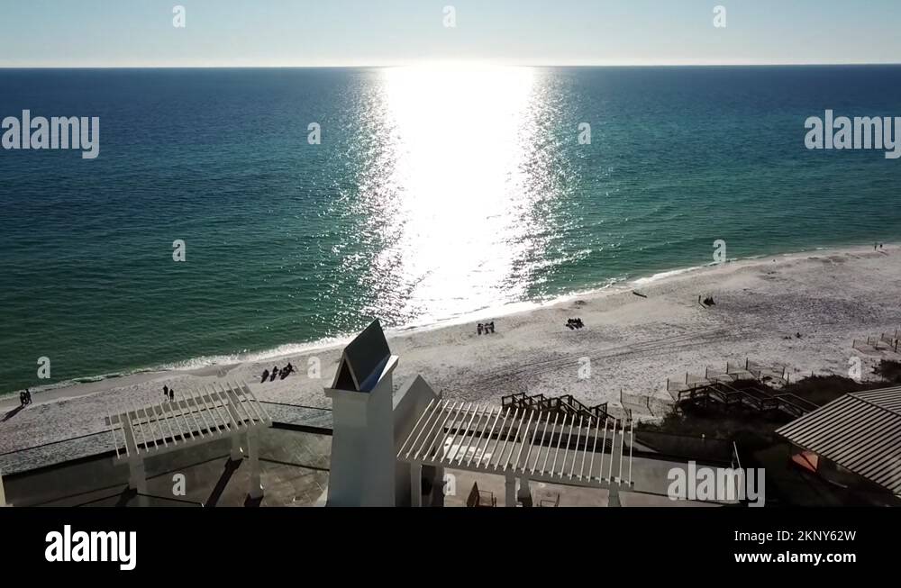Tourists Relaxing At The Beach With Sunlight Reflection In The Ocean At ...