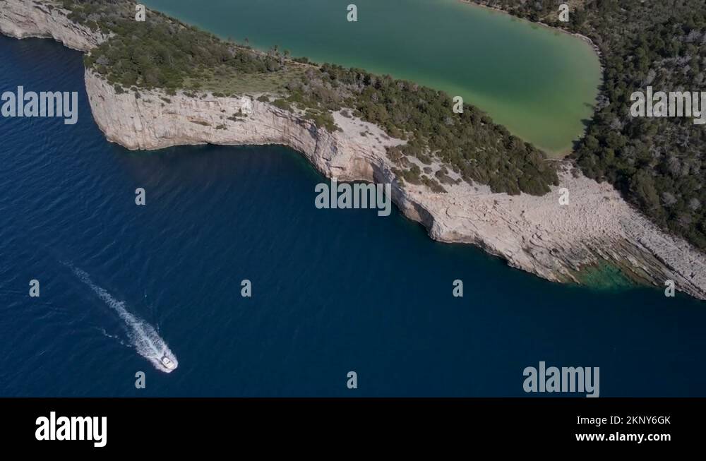 Mir Lake at Croatia's National Park Kornati. Lone motorboat cruising at Stock Video Footage - Alamy