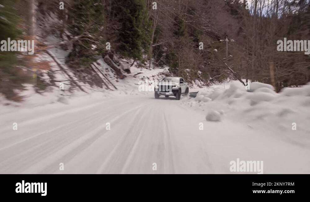 Rolling shot of Ford Ranger Raptor pickup truck car driving on mountain ...