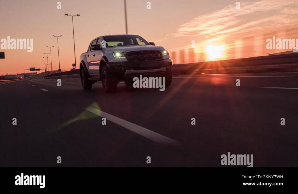 Rolling shot of Ford Ranger Raptor SUV pickup truck car driving on ...
