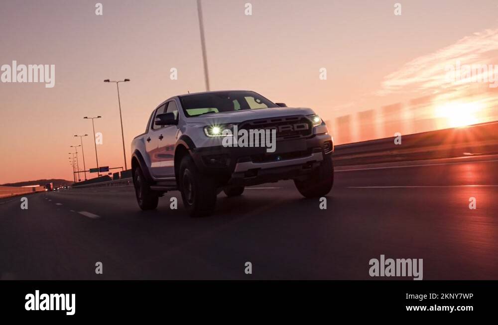 Rolling shot of Ford Ranger Raptor SUV pickup truck car driving on ...