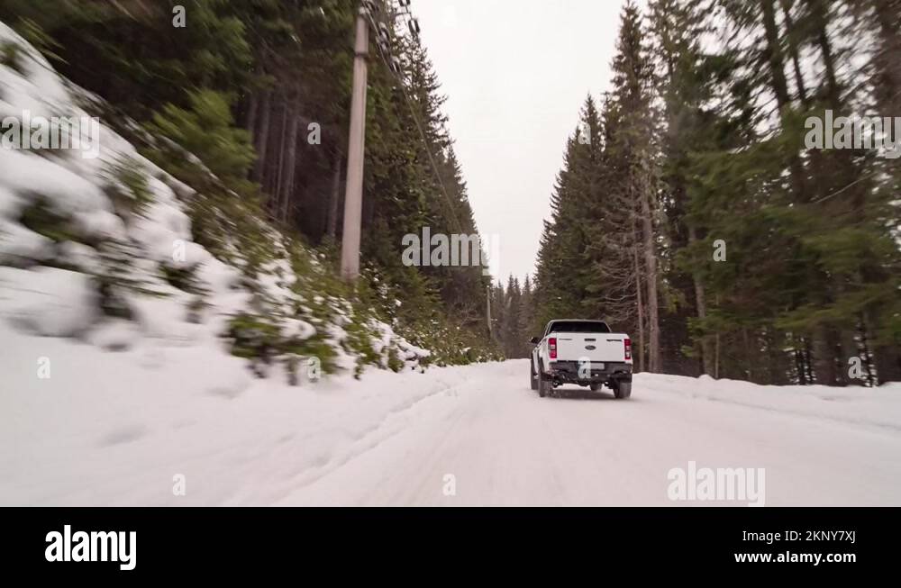 Rolling shot of Ford Ranger Raptor pickup truck car driving on mountain ...